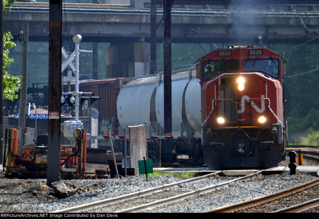 CN 5629 leads Q418-21 out of Woodbourne Yard